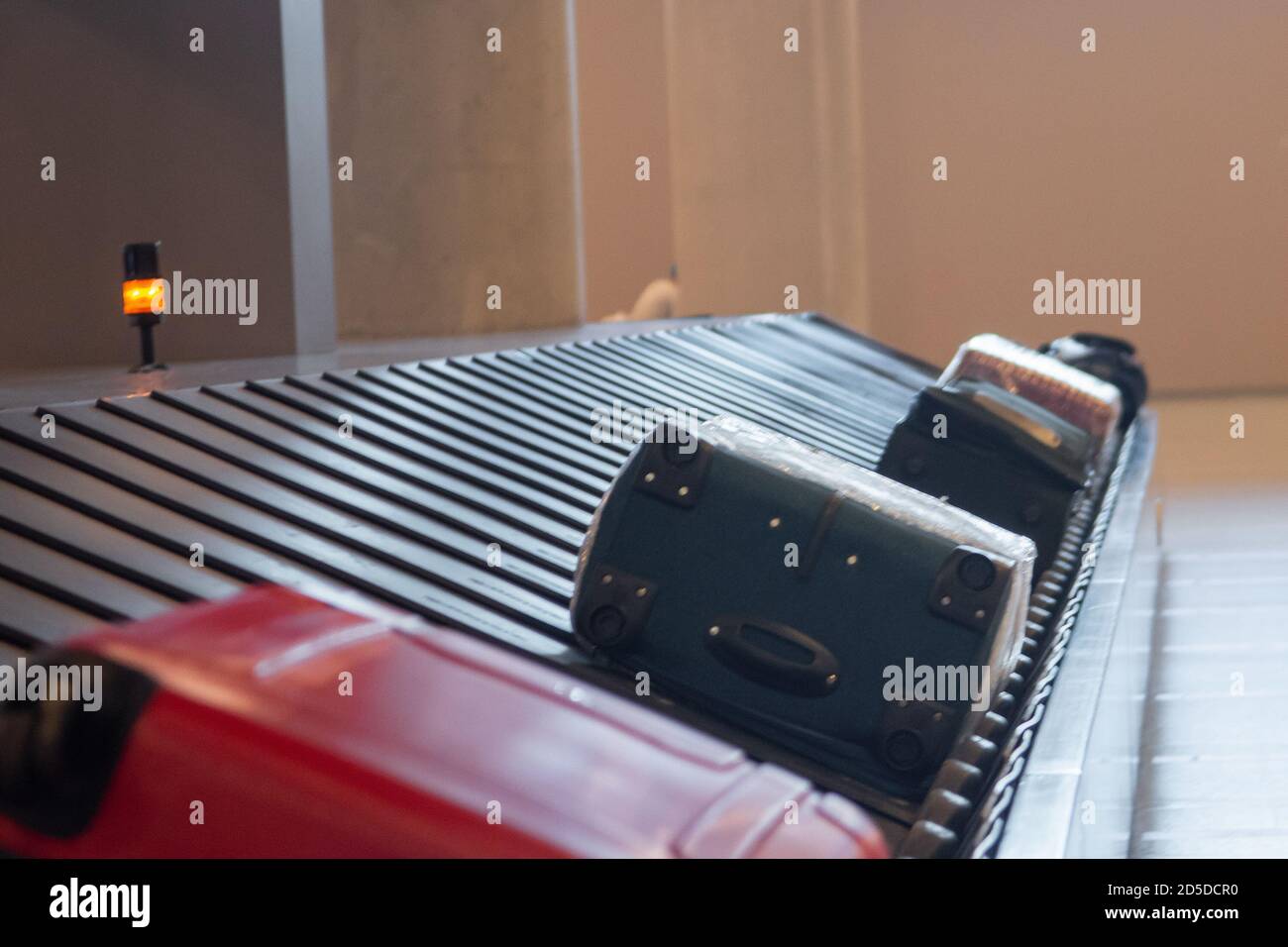 Baggage Claim. Suitcase on luggage conveyor belt in the baggage claim ...