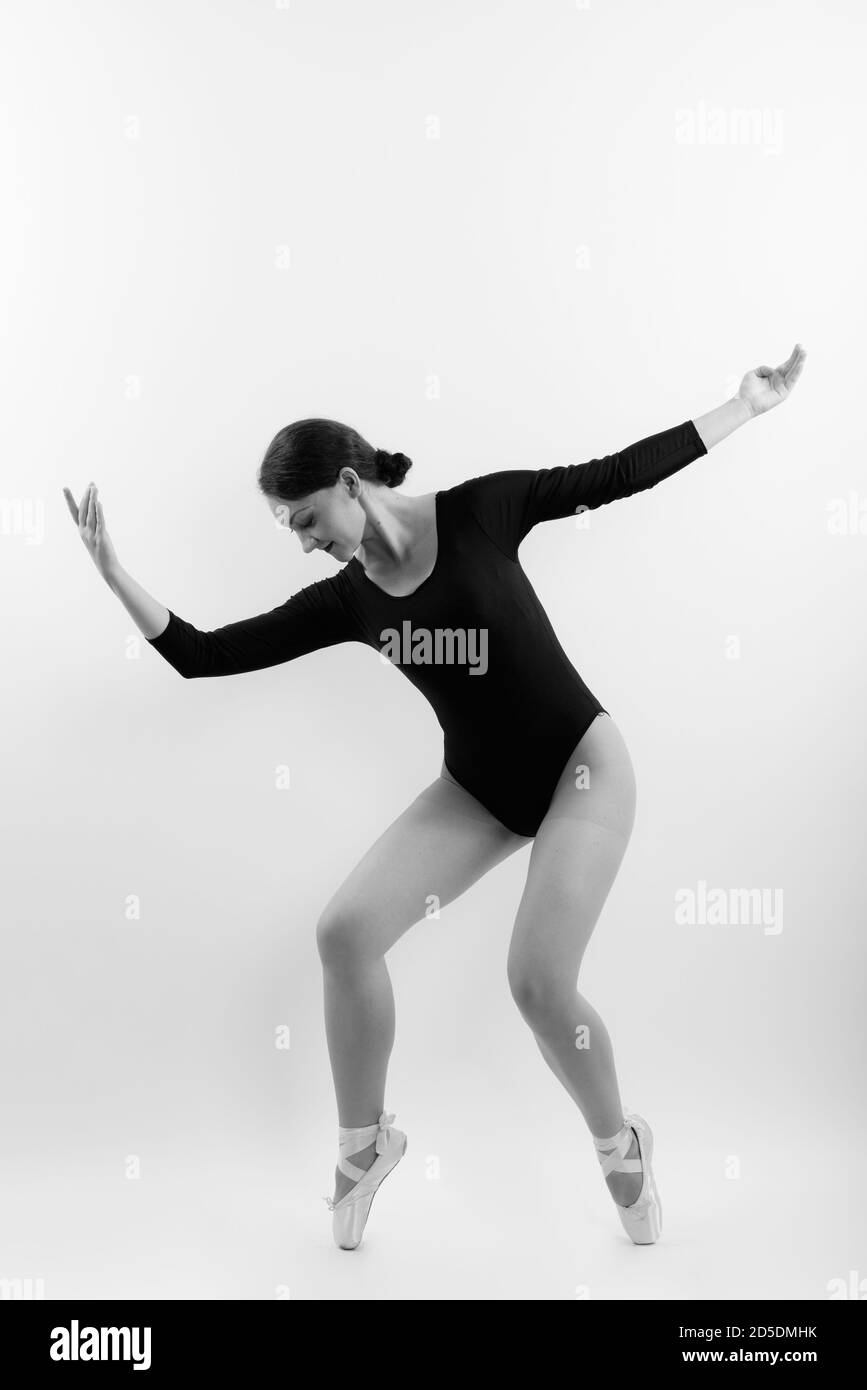 Full body shot of woman ballet dancer posing on toes Stock Photo - Alamy