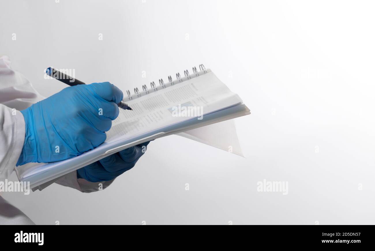 Woman doctor writes notes prescription hi-res stock photography and ...
