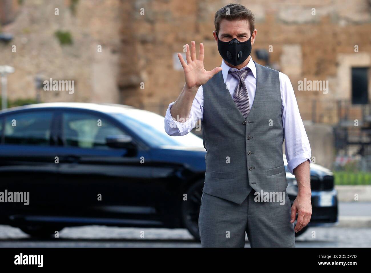 Rome, Italy. 12th Oct, 2020. Actor Tom Cruise wearing a face mask waves ...