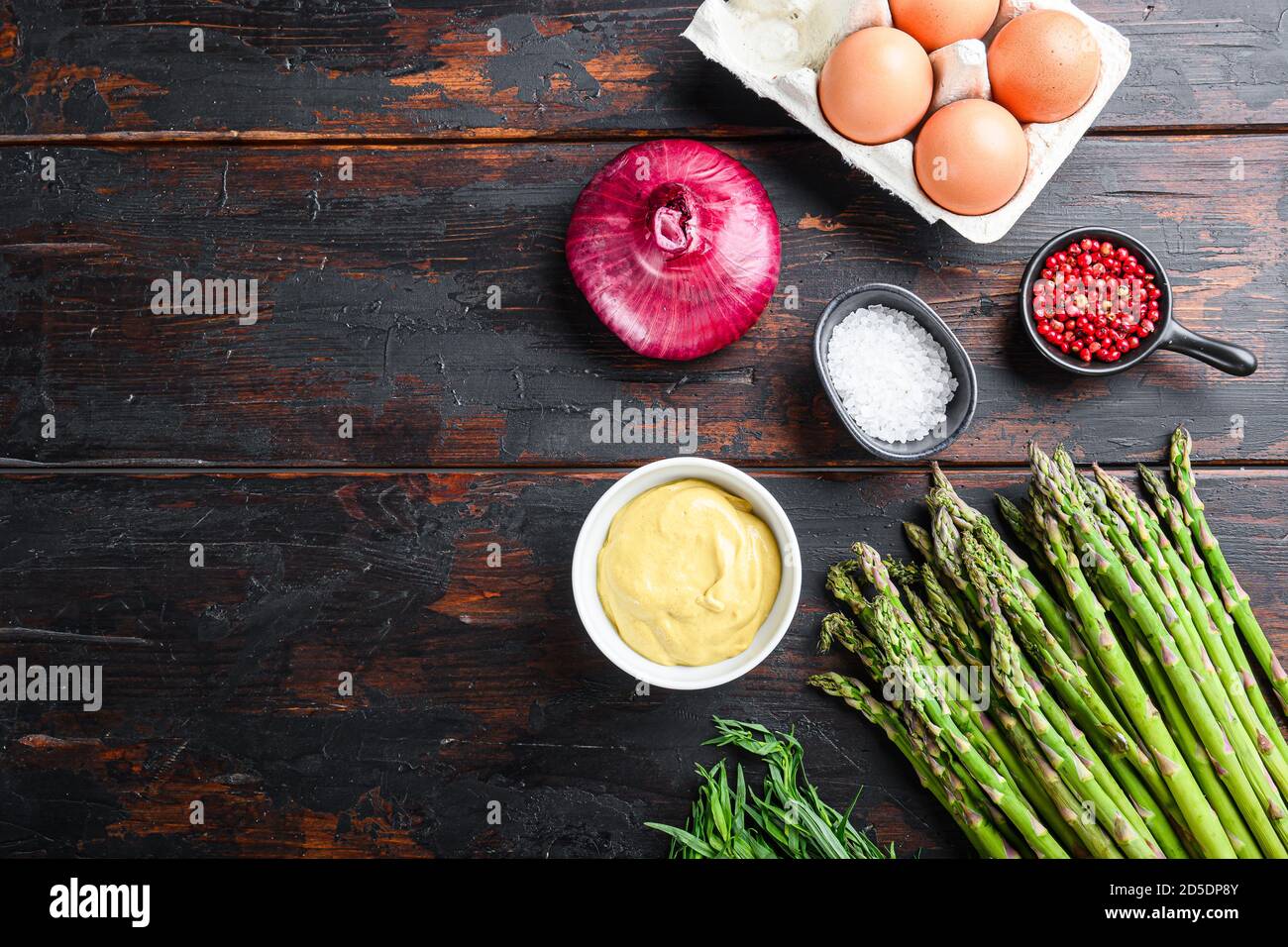 Raw asparagus eggs and french dressing ingredients with dijon mustard ...