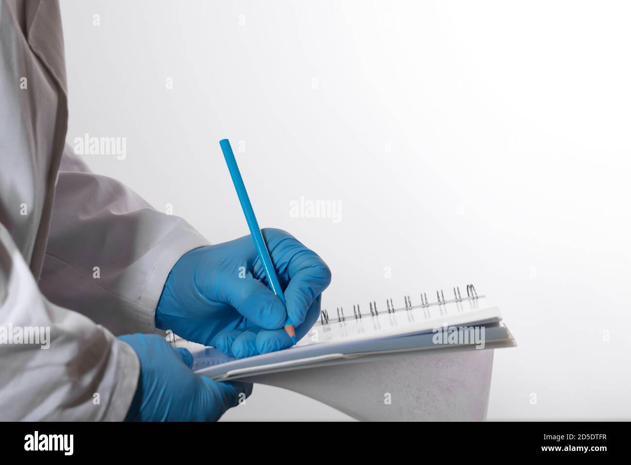 Woman doctor writes notes prescription hi-res stock photography and ...