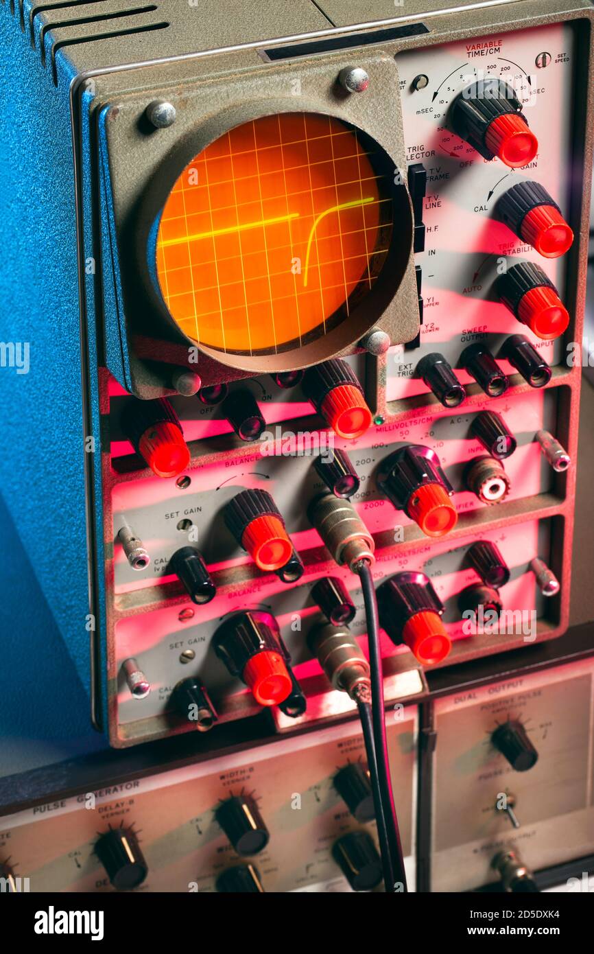 Front view of a vintage isolated oscilloscope on a pulse generator ...
