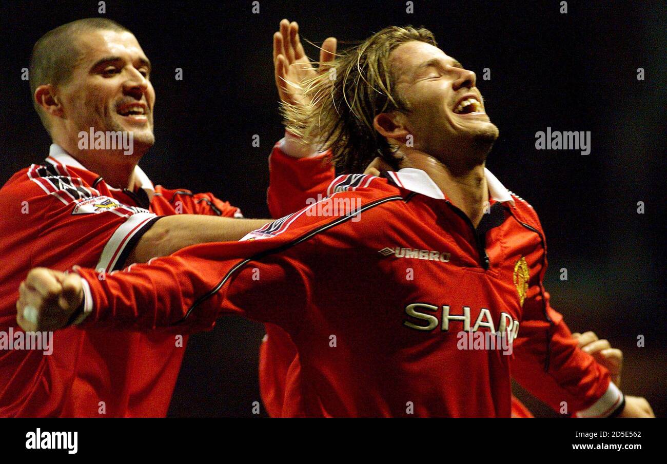 David beckham celebrates his goal with roy keane hi-res stock ...