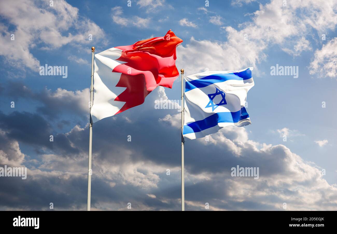 Flags of Israel and Bahrain together against the sky background ...