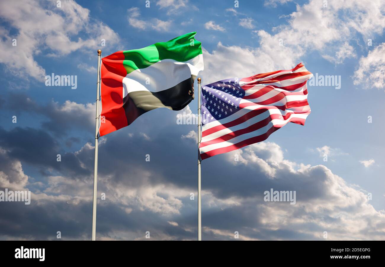 Flags of USA and UAE together against the sky background. Symbol of ...