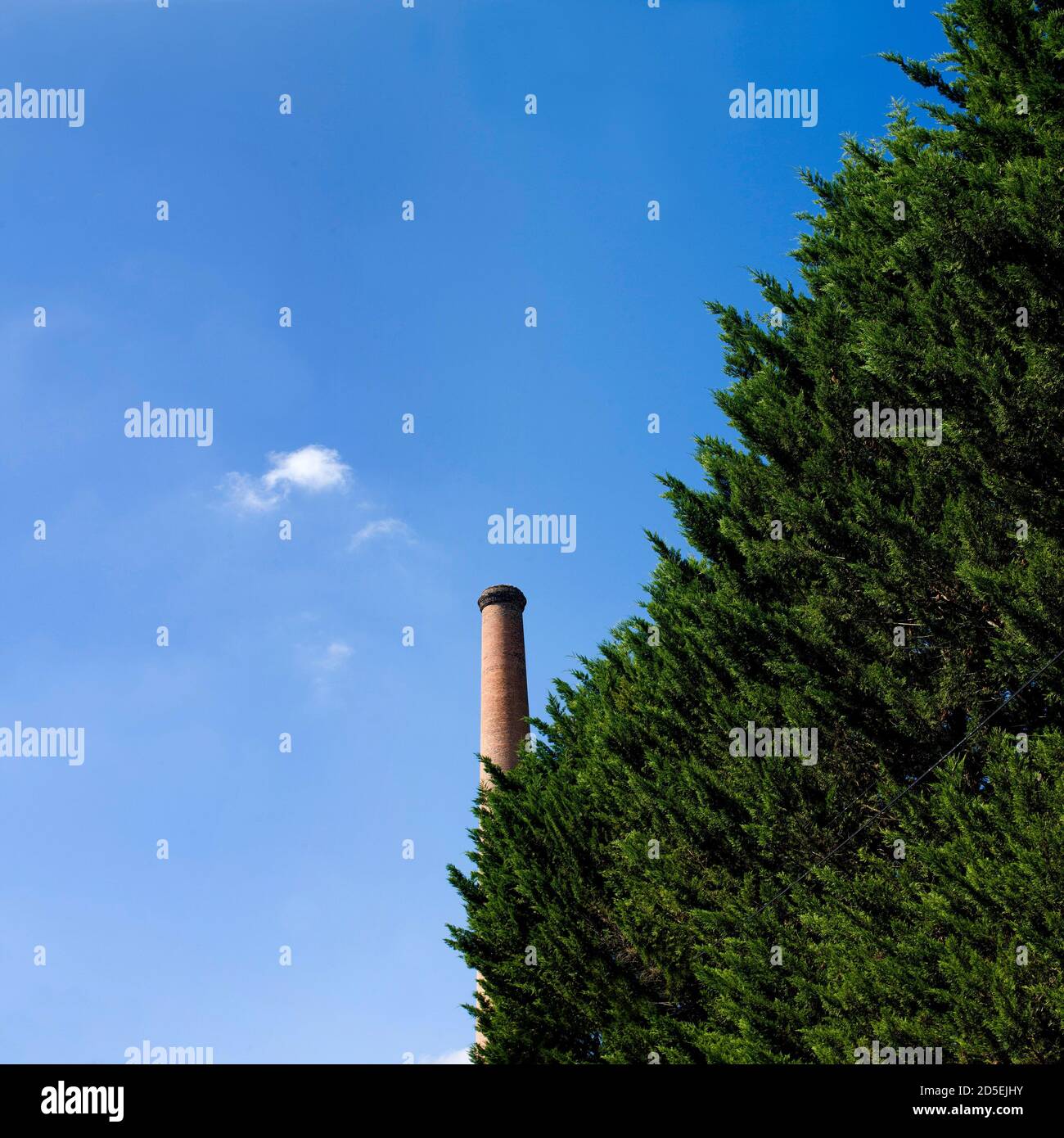 Tall brick industrial chimney. Auvergne. France Stock Photo - Alamy