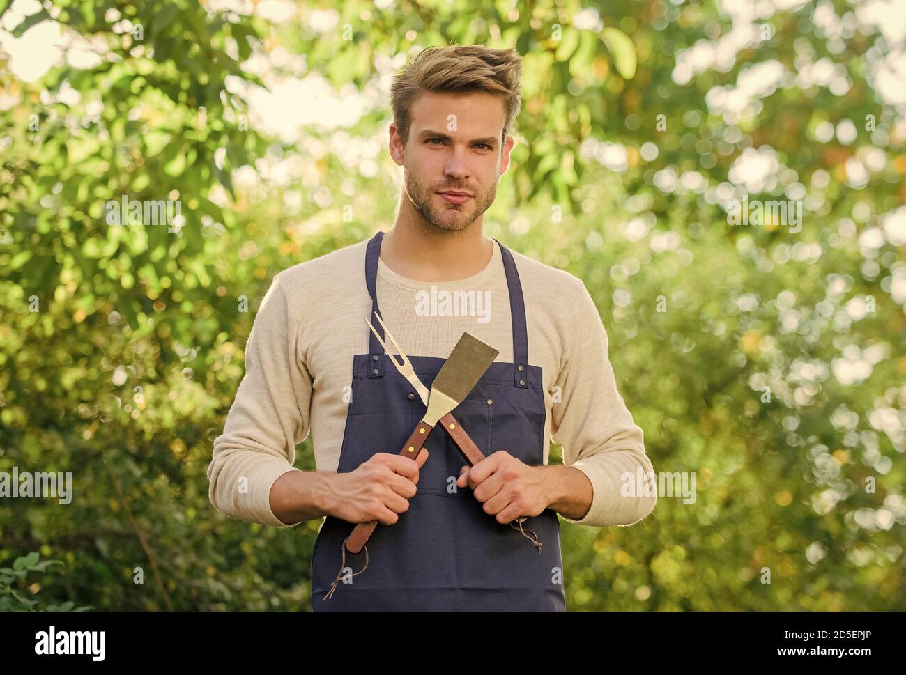 Barbeque party. Picnic concept. Bbq chef. Handsome guy cooking food ...