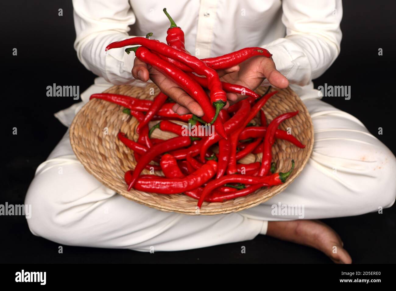 Man's hands hold red pepper Stock Photo - Alamy