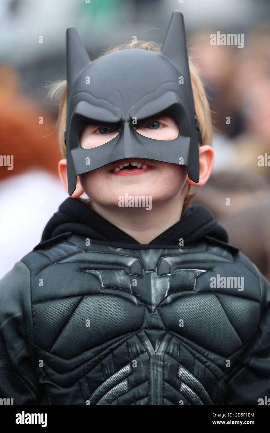 A Batman fan watches during the filming of The Batman taking place in ...
