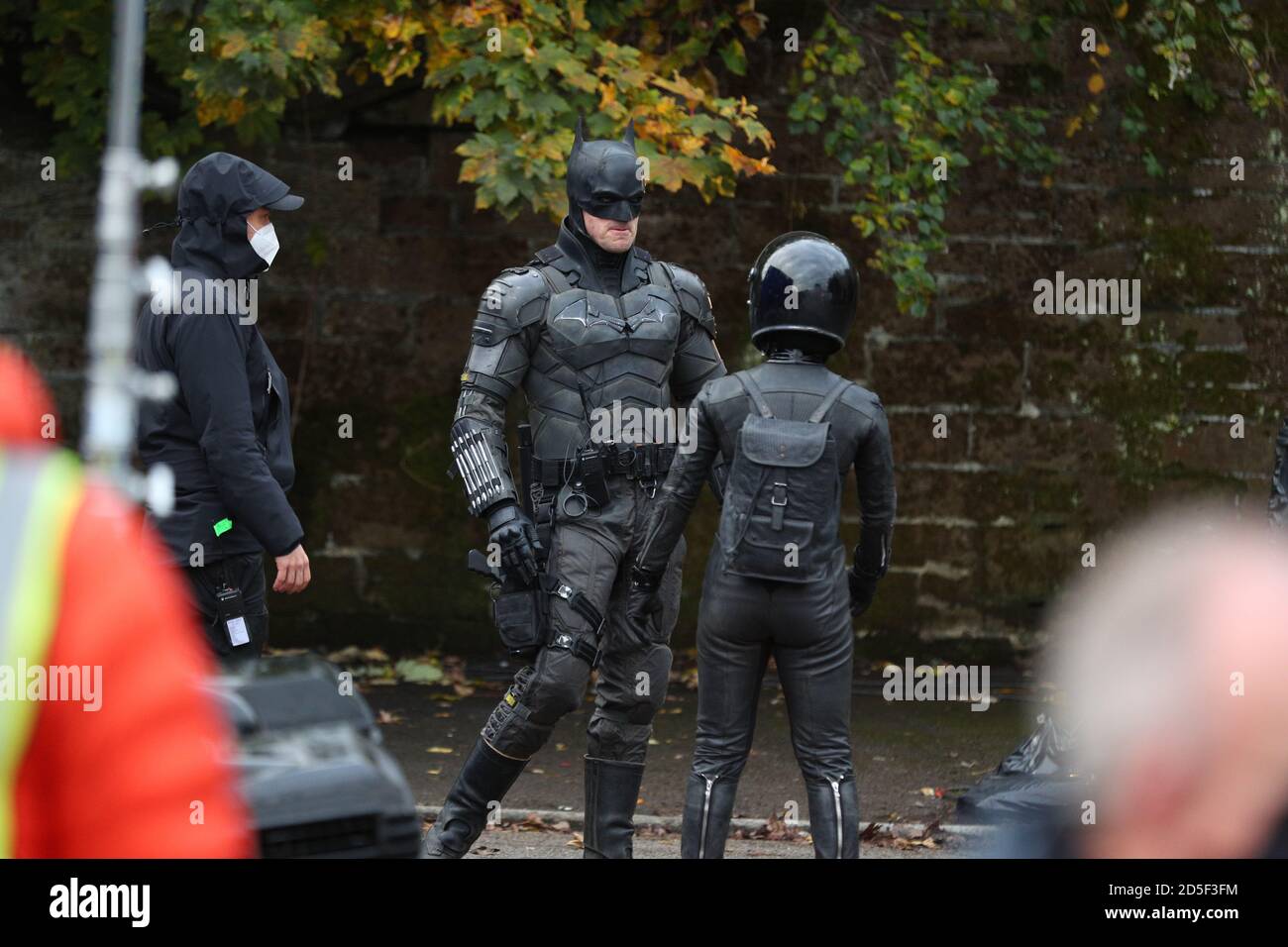 A man dressed as Batman during the filming of The Batman taking place ...