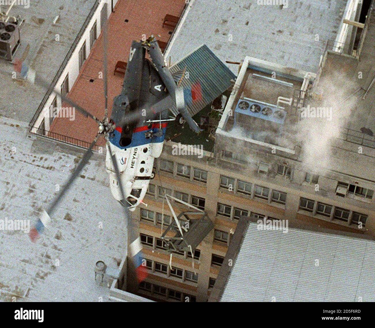 A Russian built helicopter breaks up as it hits a building in central ...