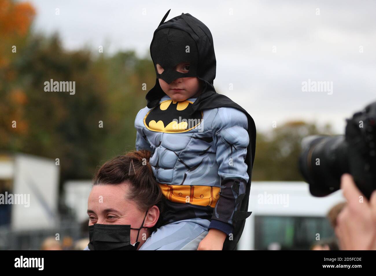 A Batman fan watches during the filming of The Batman taking place in ...