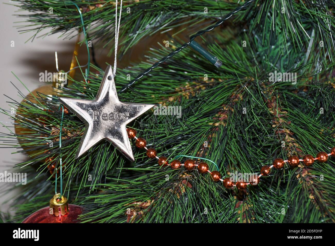 Christmas tree garland and decorations with a silver star on left for ...