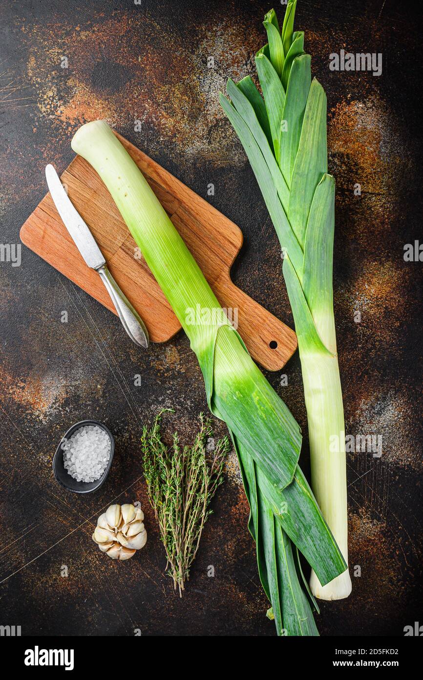 Fresh leek stalks with herbs ingredients for cooking Braised Leeks ...