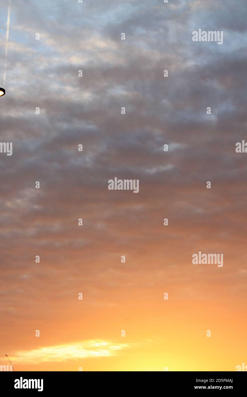 A picture of a gradient sky from blue to orange at sunset Stock Photo ...