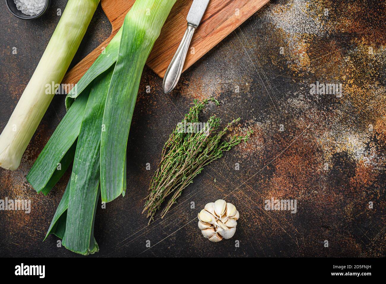 Organic leek stalks with herbs ingredients for cooking Braised Leeks ...