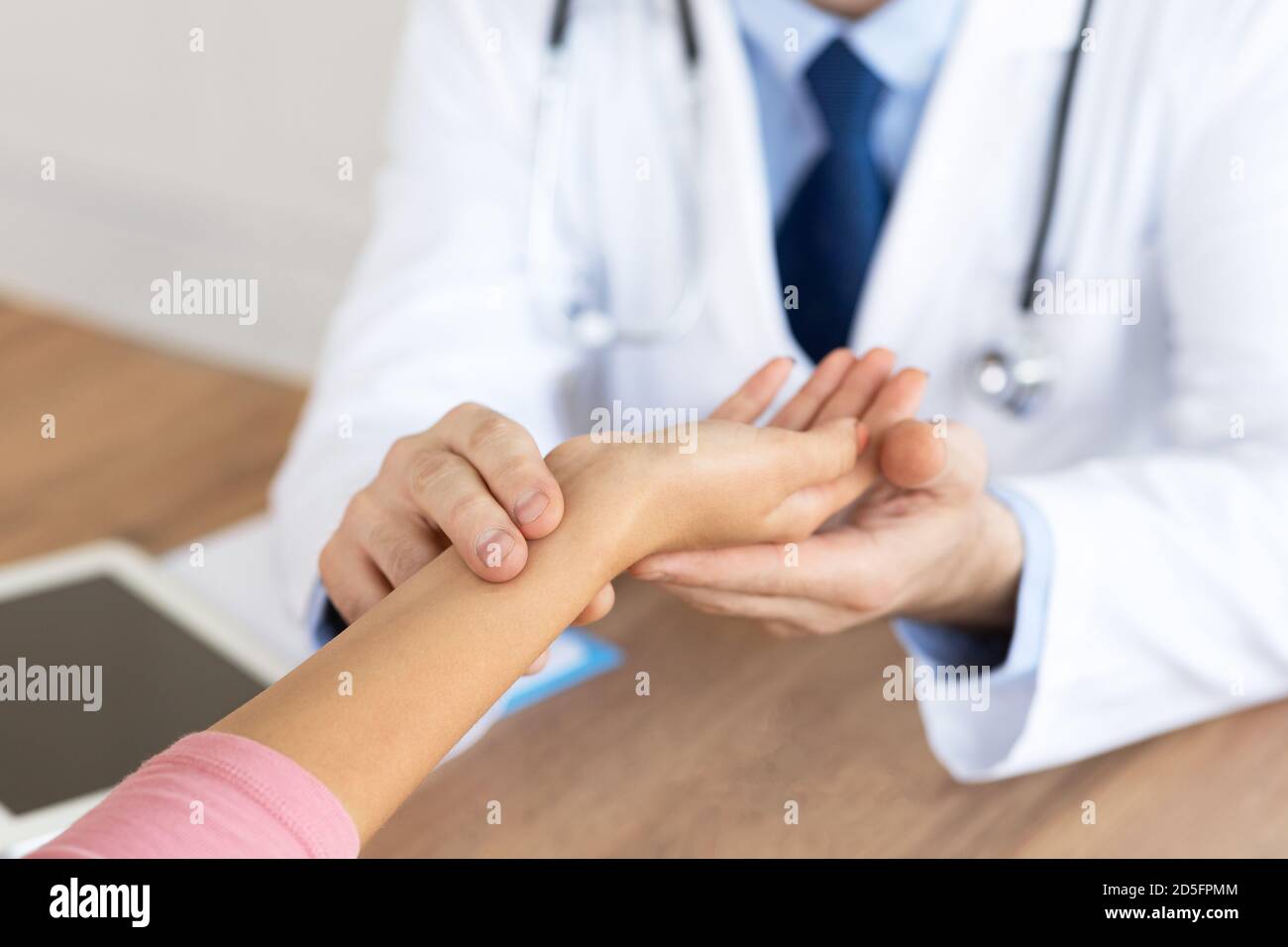 Doctor checking measuring pressure on patient's hand pulse Stock Photo ...