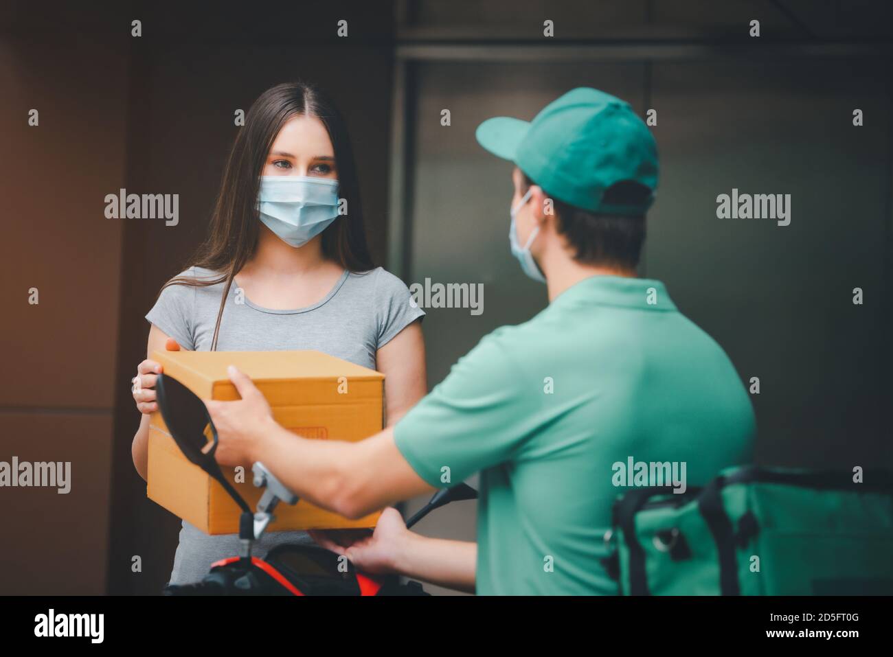 Delivery man employee in green cap t-shirt ready to send delivery food ...