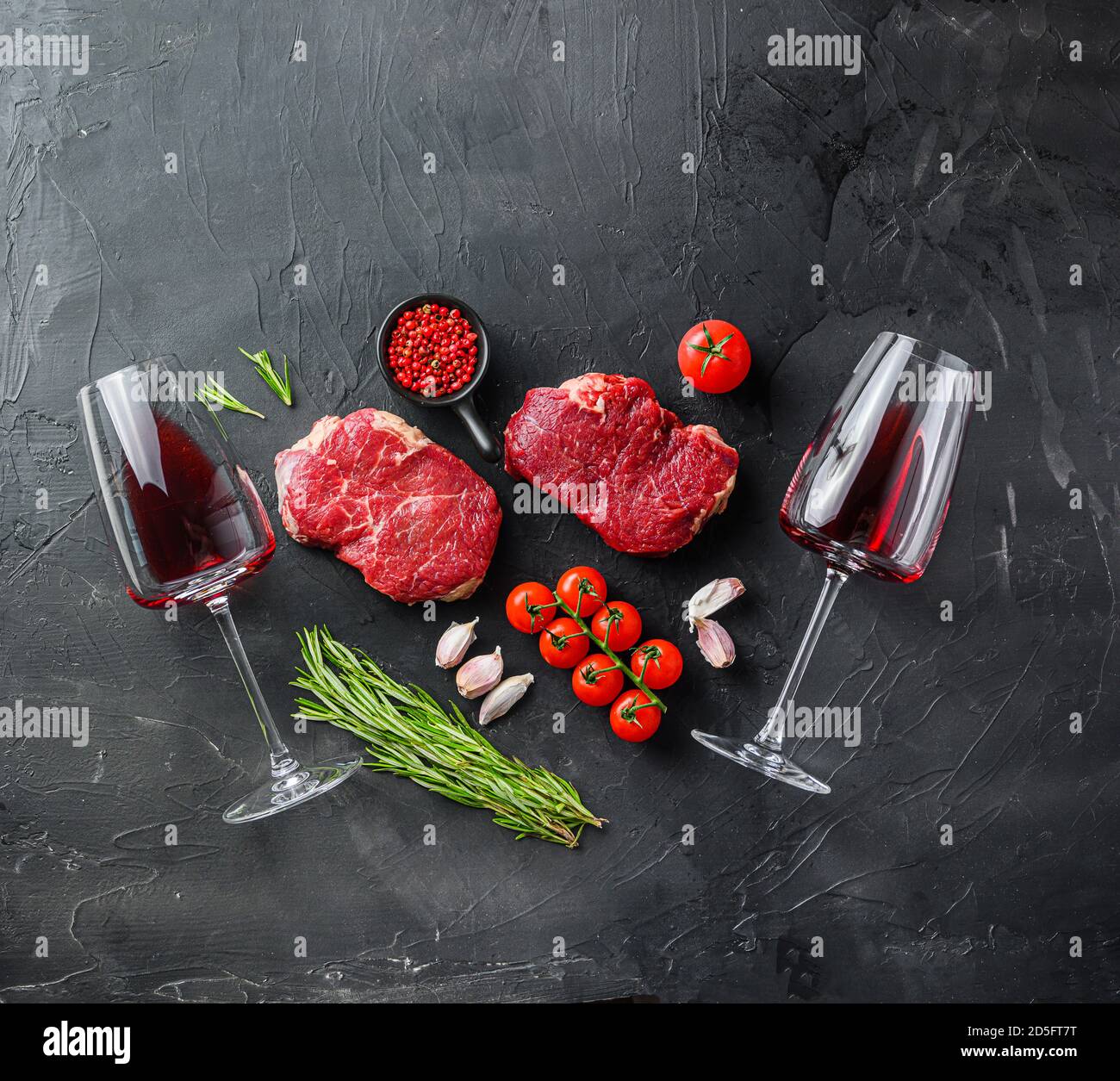 Raw ramp beef cuts with herbs, ingredients for dinner for two with ...