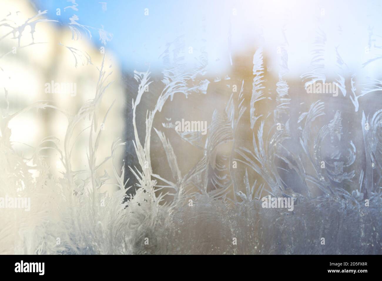 Frozen winter window with shiny ice frost pattern texture. Christmas ...