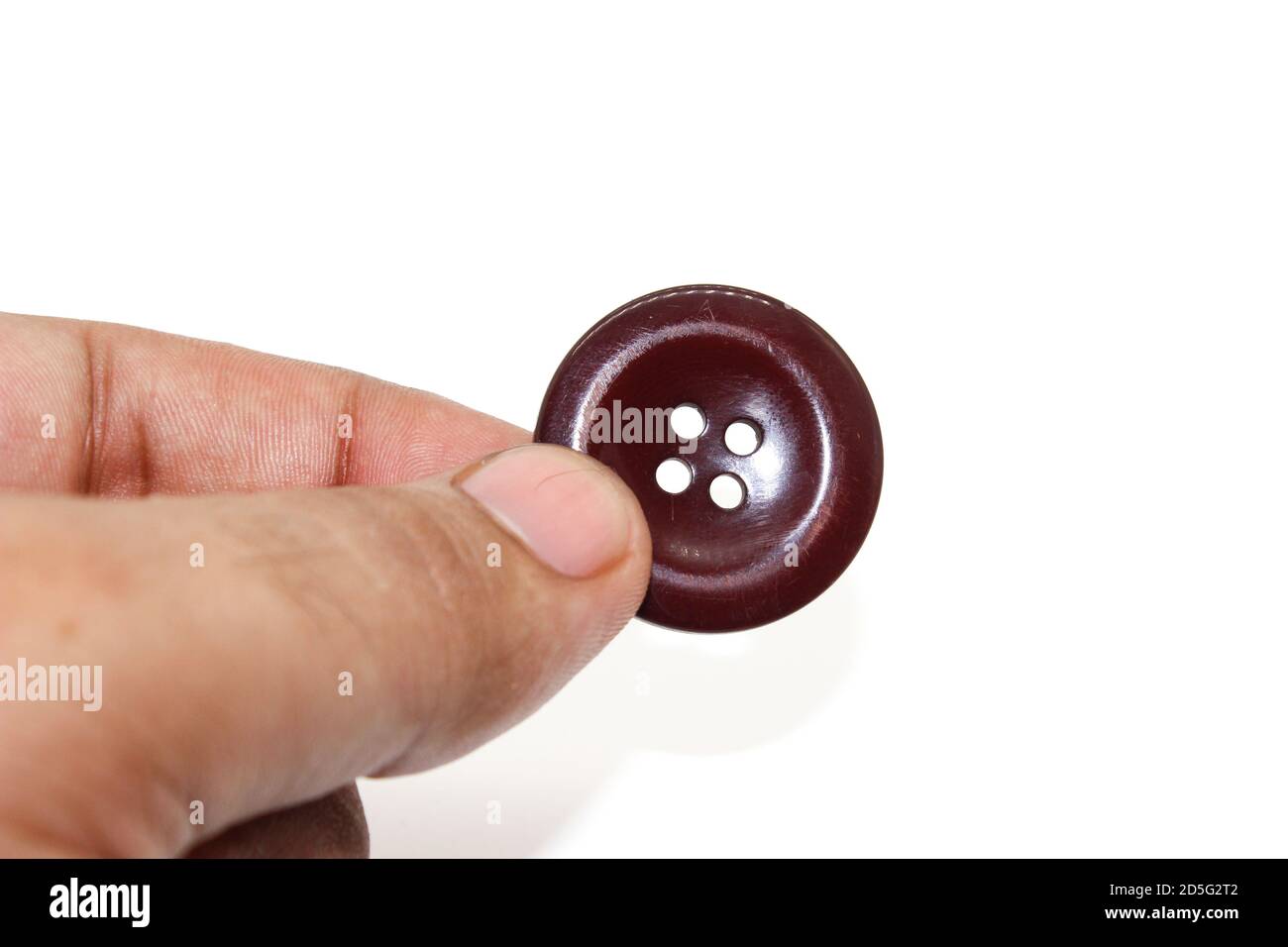 A picture of cloth button on white background Stock Photo - Alamy