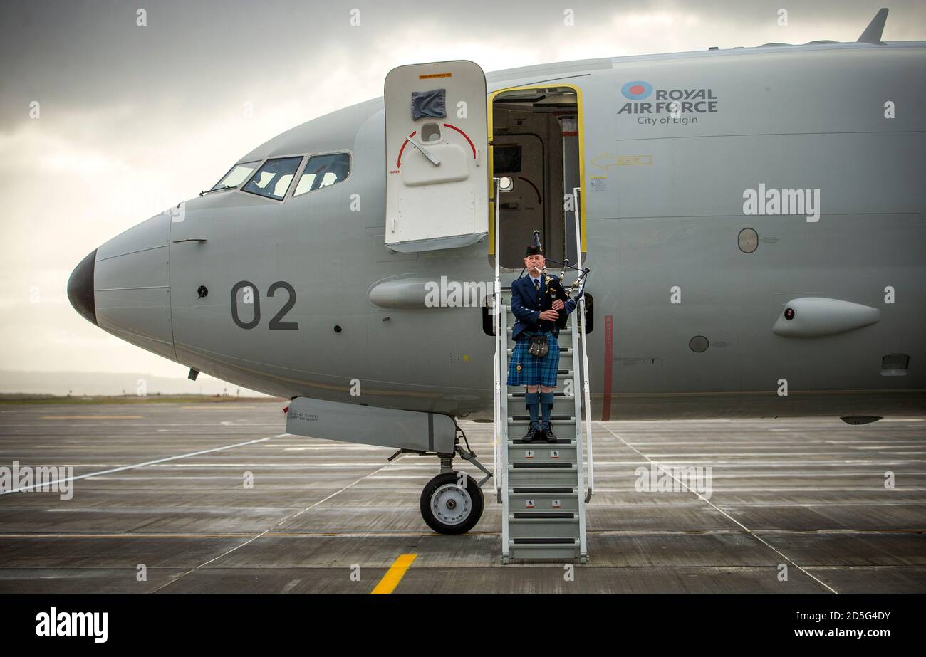 Pipe Major Barry Ashby plays on the steps of the first of the Poseidon ...