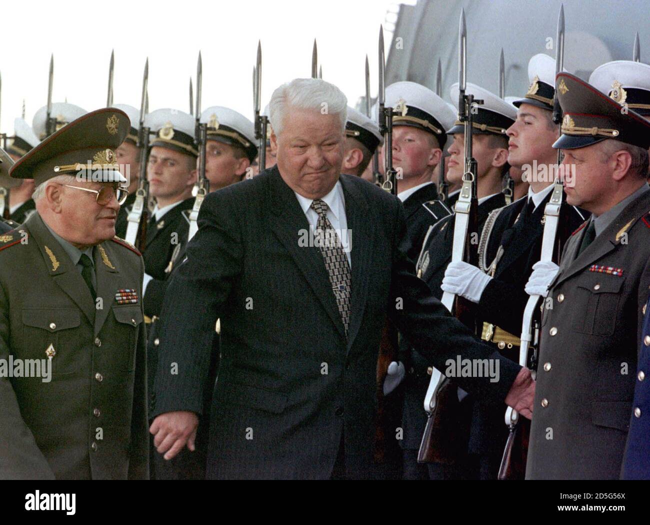 Russian President Boris Yeltsin (C) gestures as he inspects a guard of ...