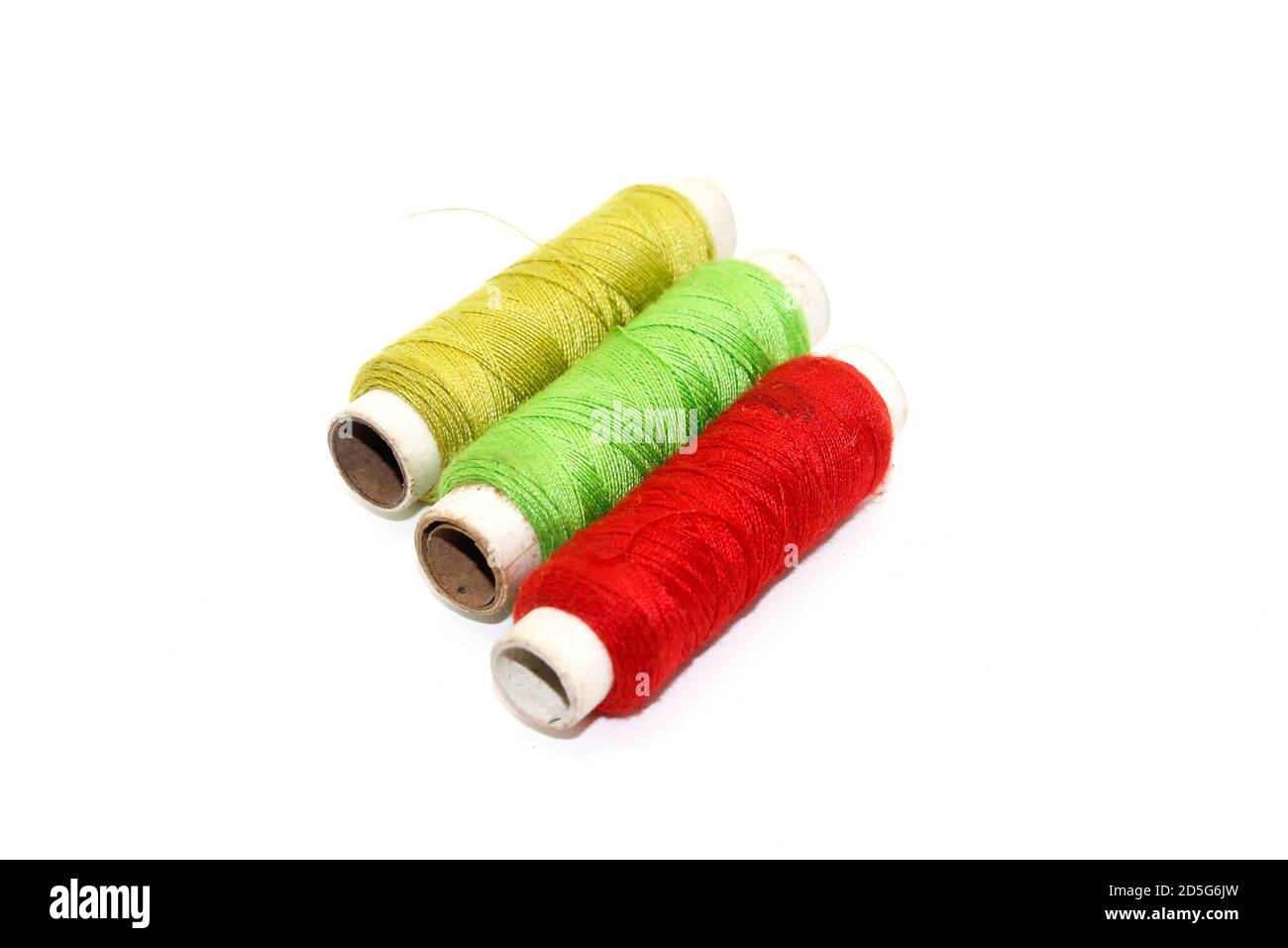 A picture of thread rolls on white background Stock Photo - Alamy