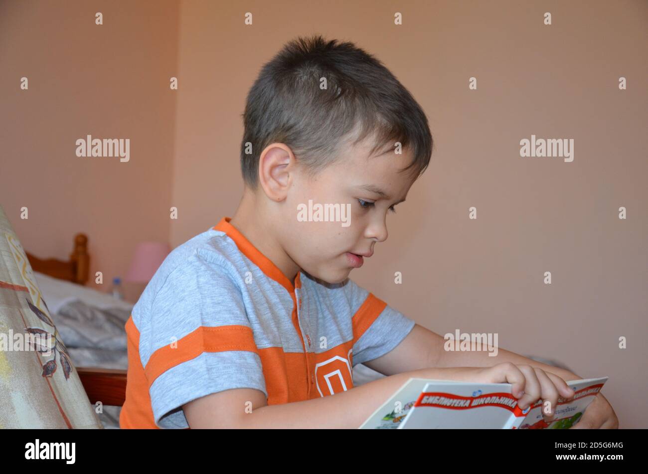 Caucasian teen boy reading book hi-res stock photography and images - Alamy