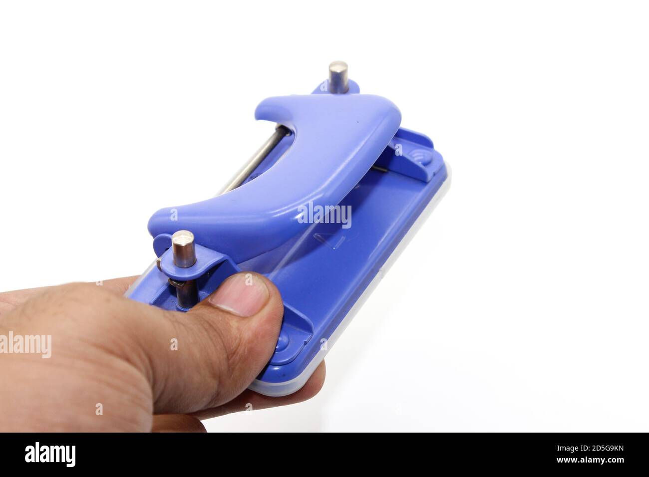 A picture of paper punching machine on white background Stock Photo - Alamy