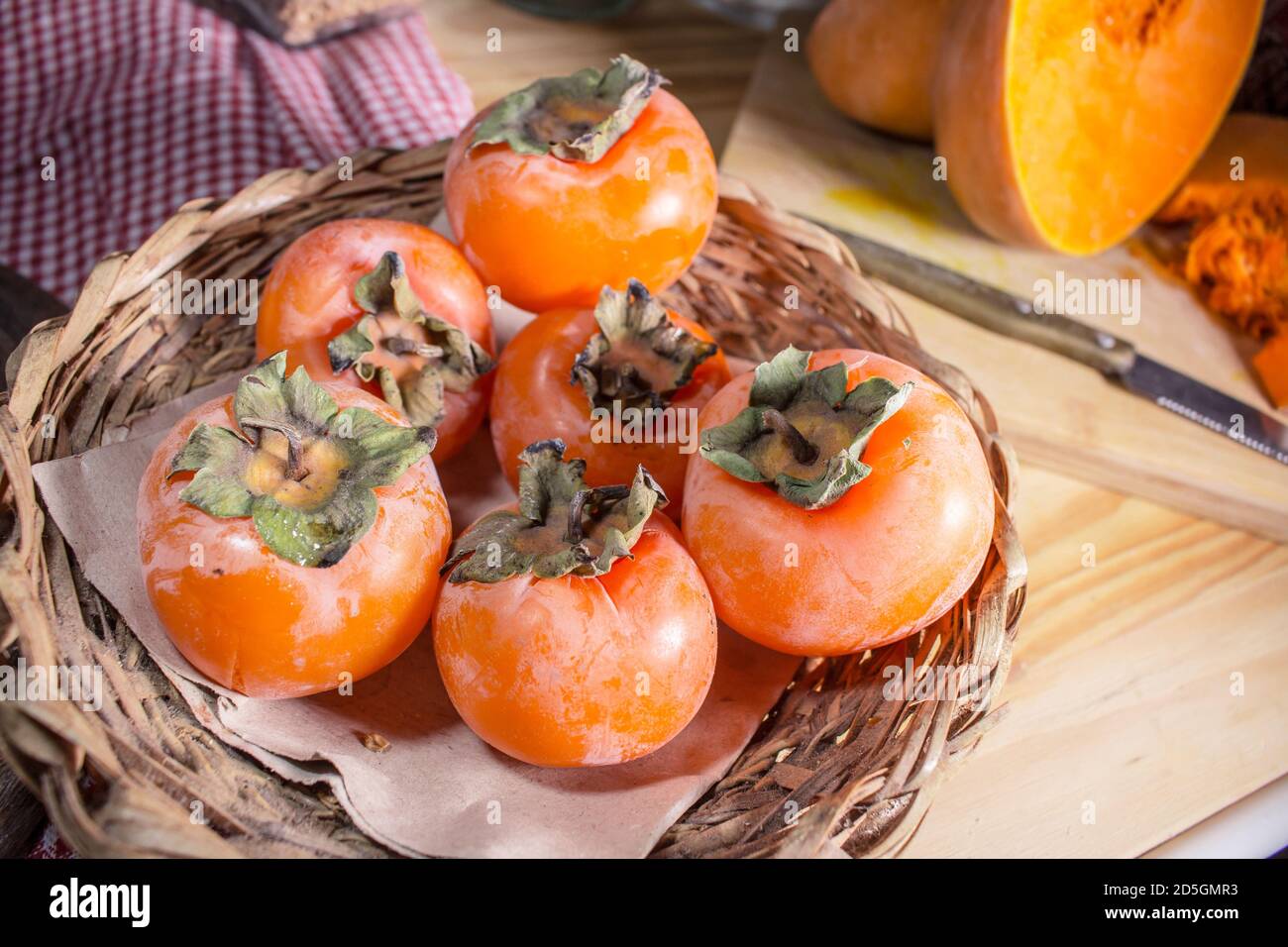 Basket of persimmons hi-res stock photography and images - Alamy