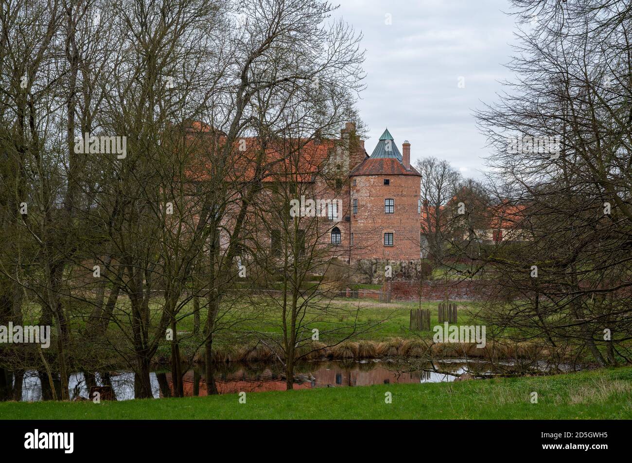 The exterior facade of the castle Torup embedded in the forest in ...