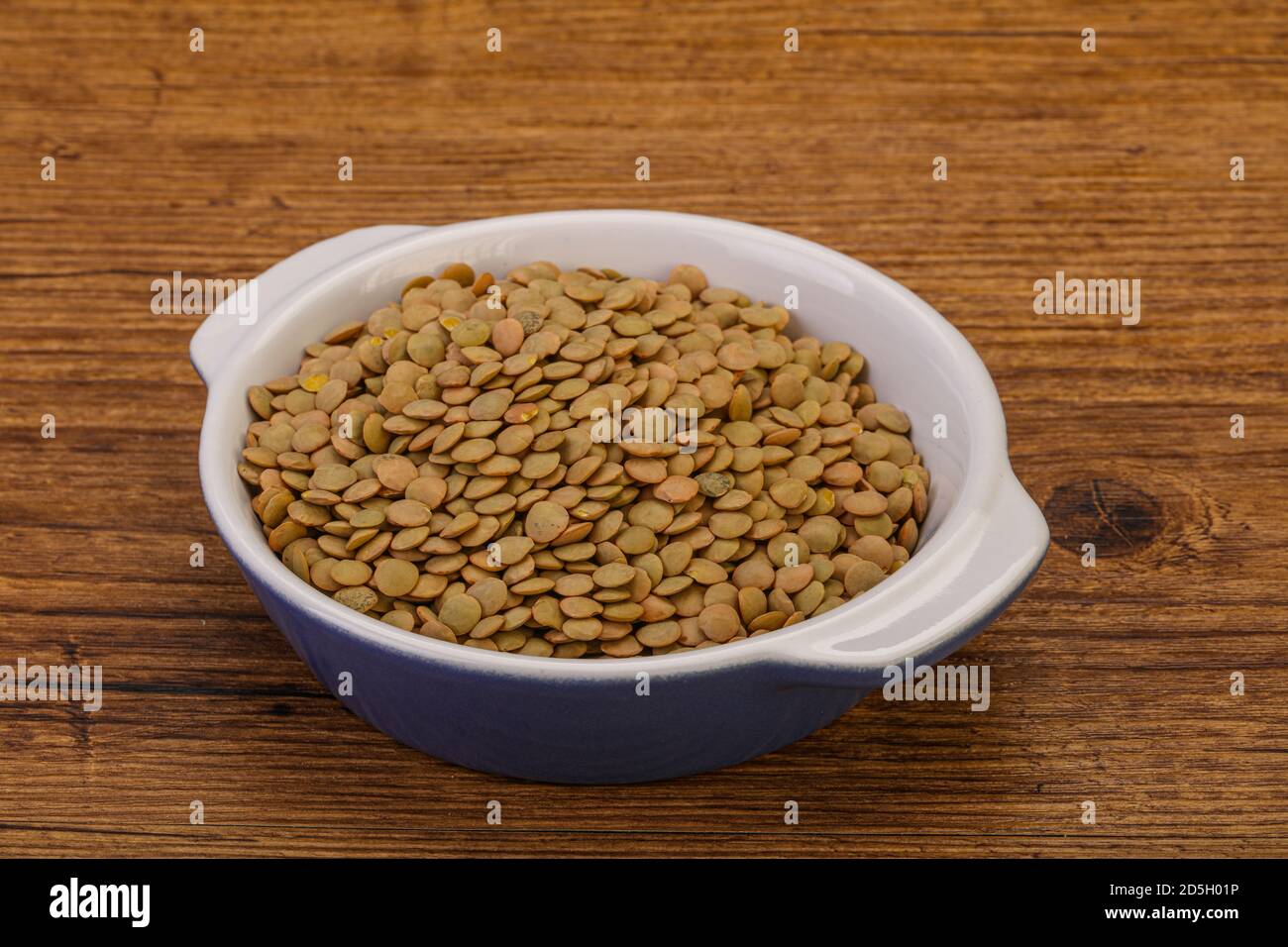 Vegan cuisine - Dry lentil heap isolated Stock Photo - Alamy