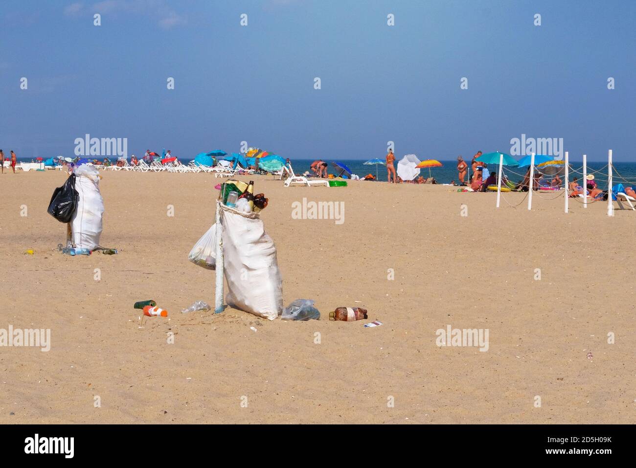 Garbage bags on the sea coast. Dumpsters bag full with garbage. Garbage ...