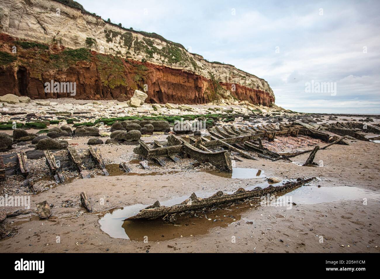 Consolidated Cretaceous strata form active cliffs north of the town of ...