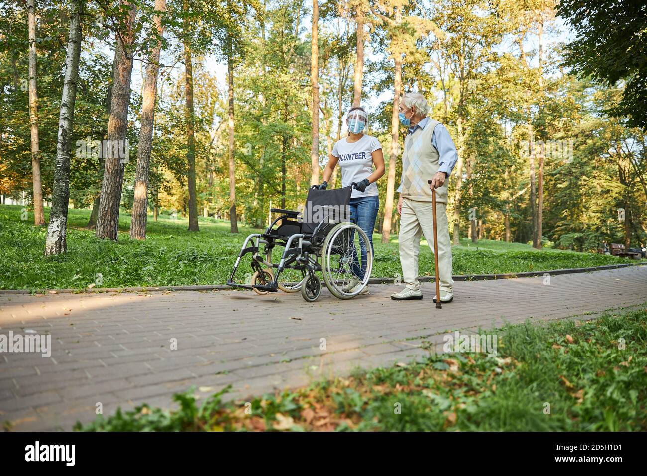 Two happy person walking in the outdoors with good weather Stock Photo ...