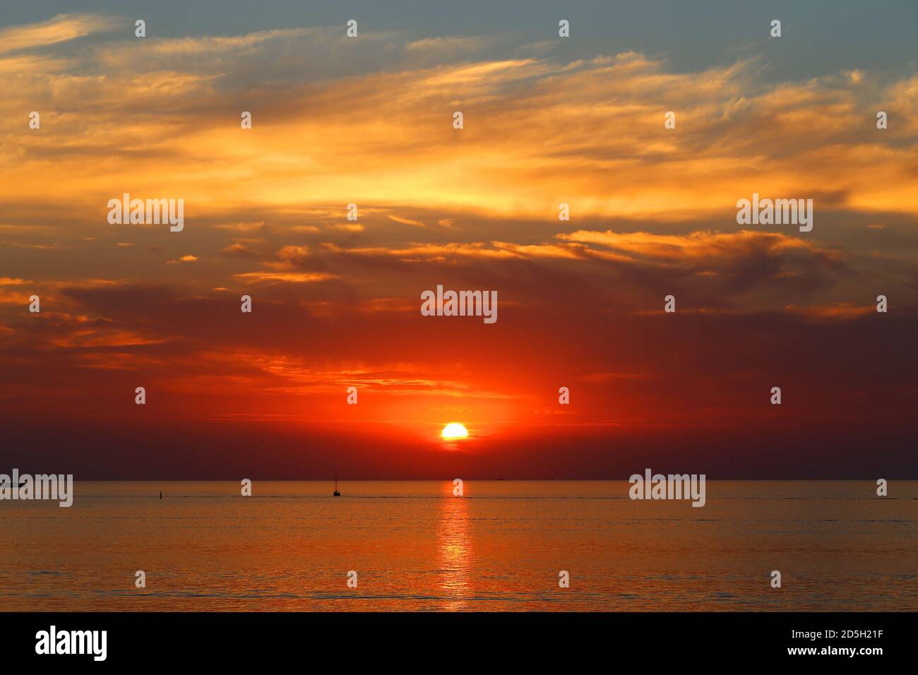 Island sea view ships with sun and nature sunset hi-res stock ...