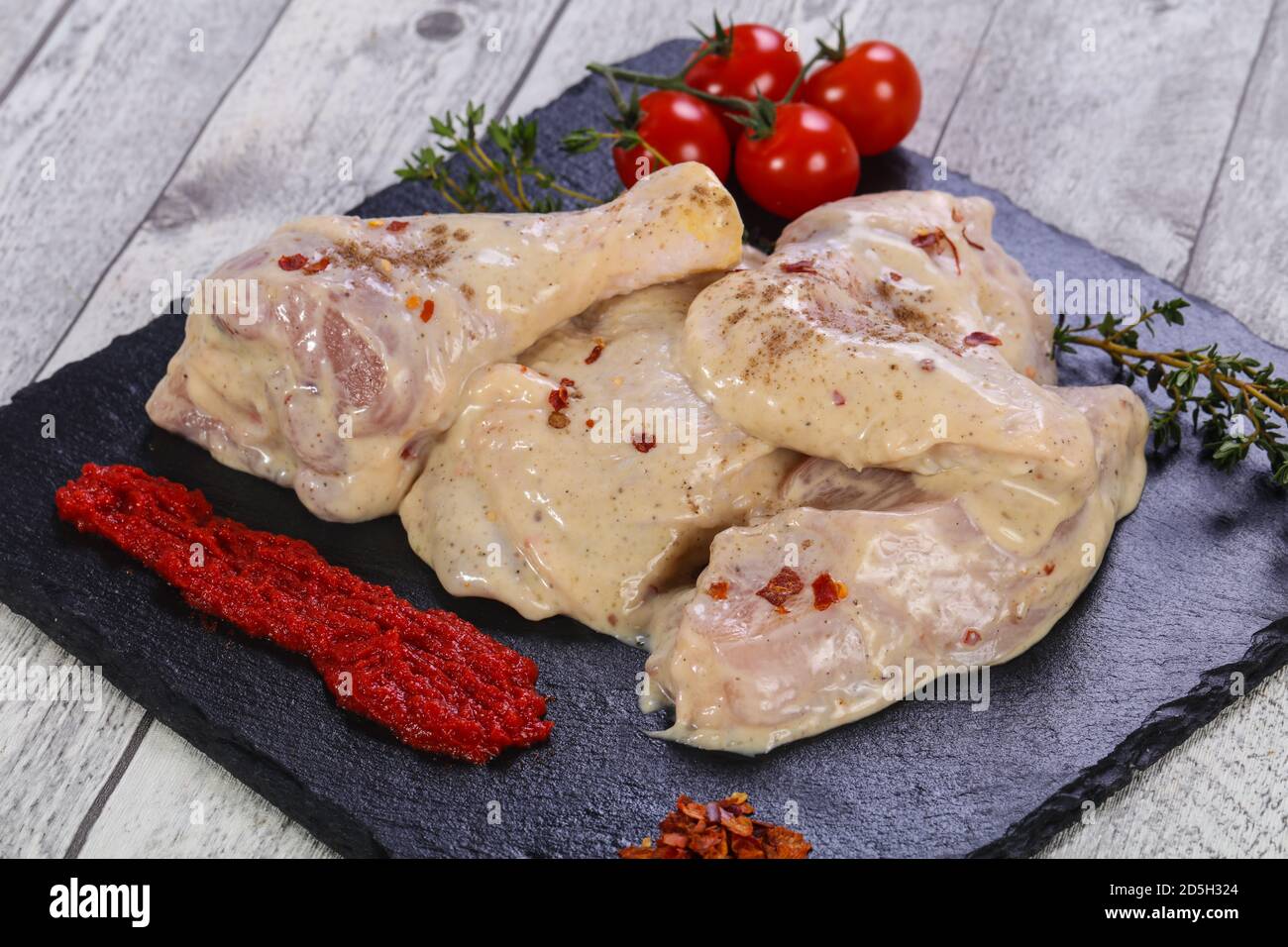Marinated chicken parts ready for roast Stock Photo - Alamy