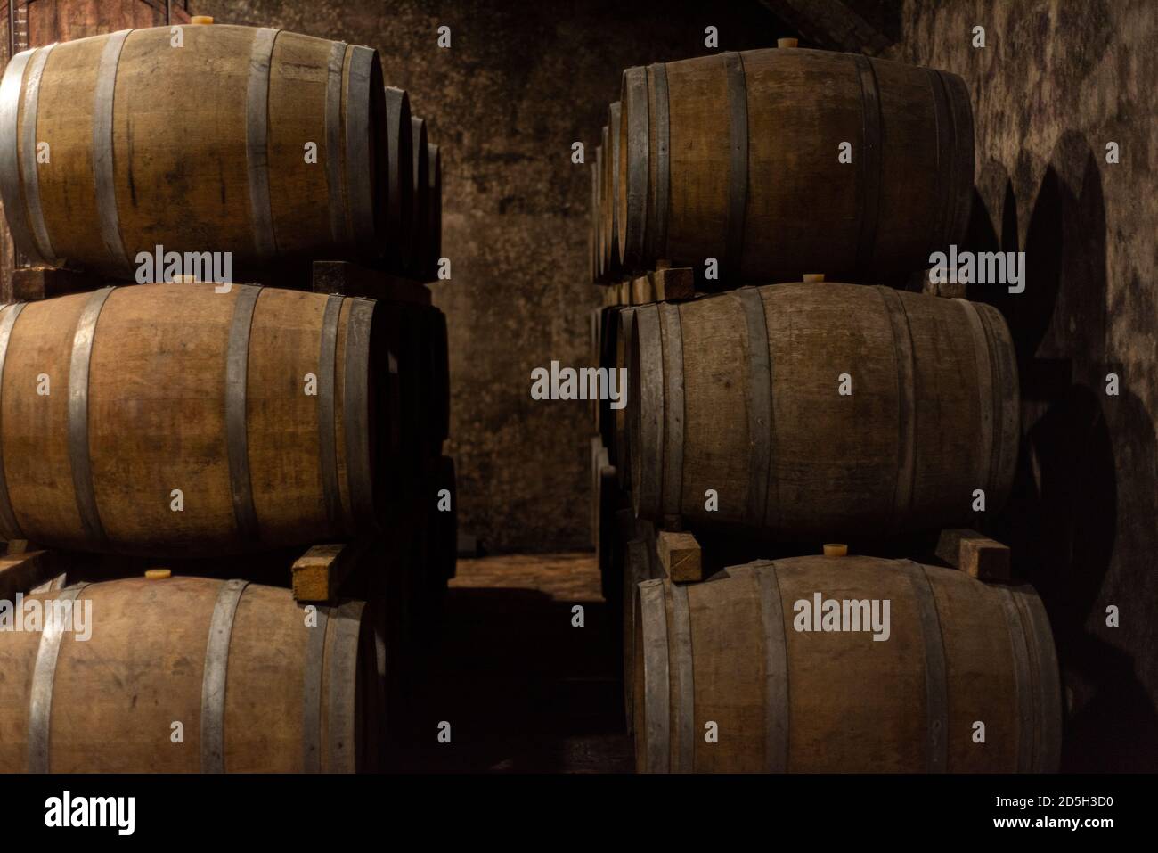 Wooden barrels for wine aging in the cellar. Italian wine Stock Photo ...