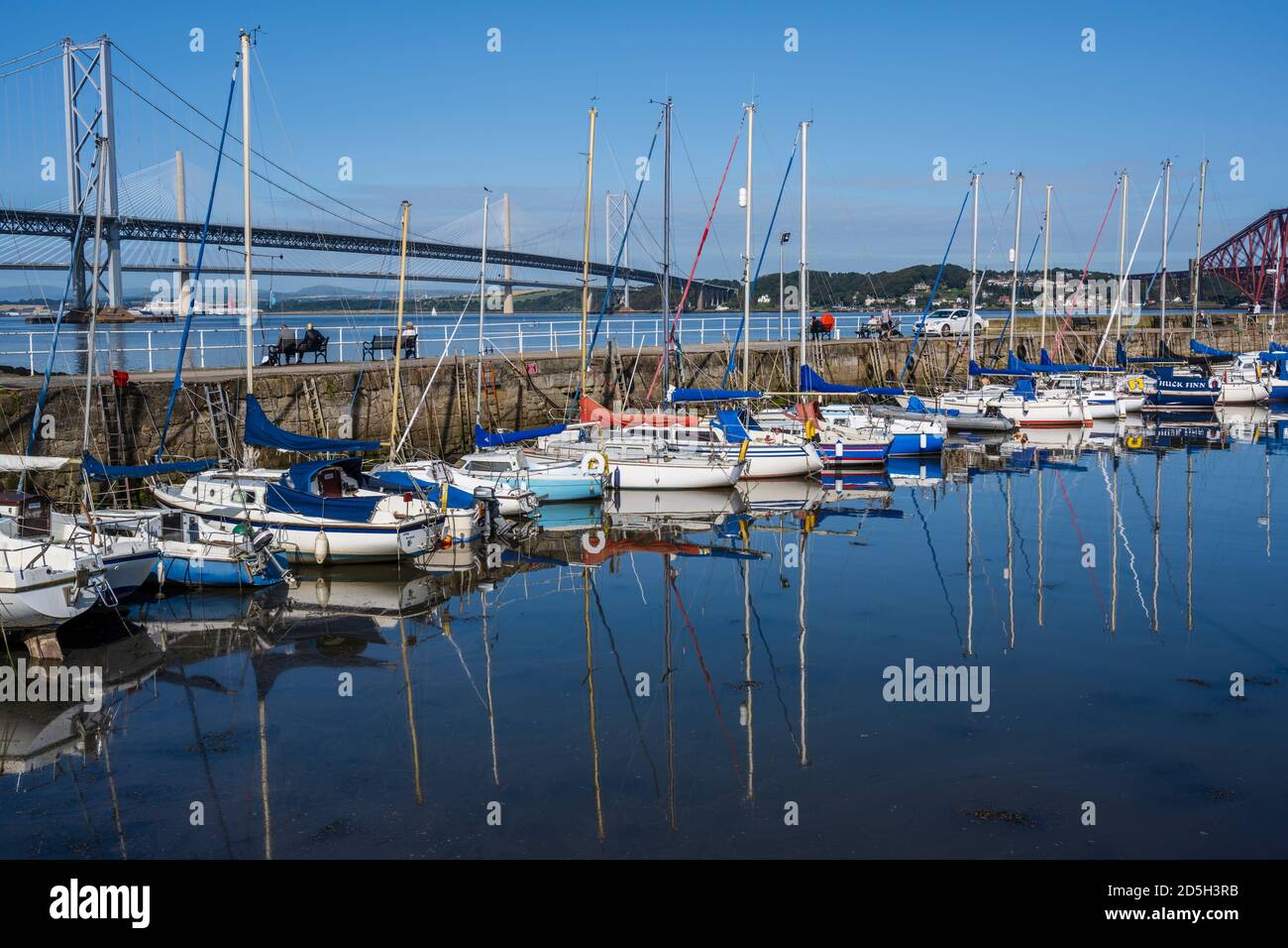 Colourful yachts moored in sheltered South Queensferry harbour with ...