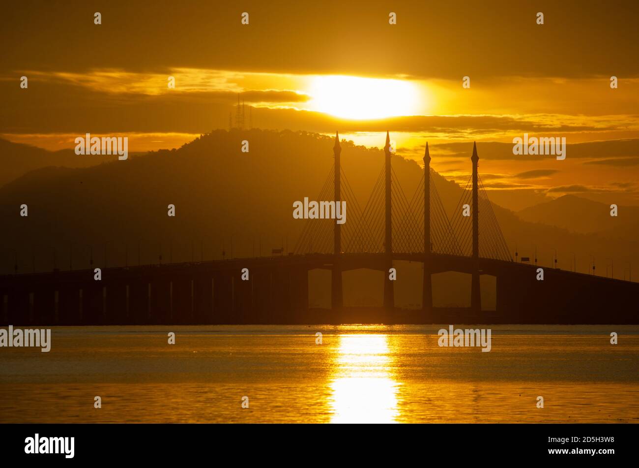 Beautiful scenery of Penang Bridge over the sea at sunset Stock Photo ...