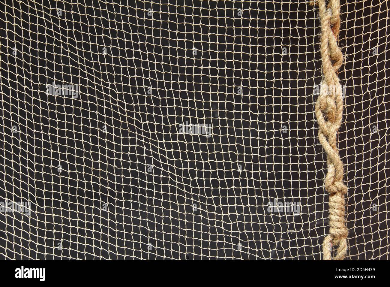 Closeup shot of fishnet with a rope - perfect for background Stock ...