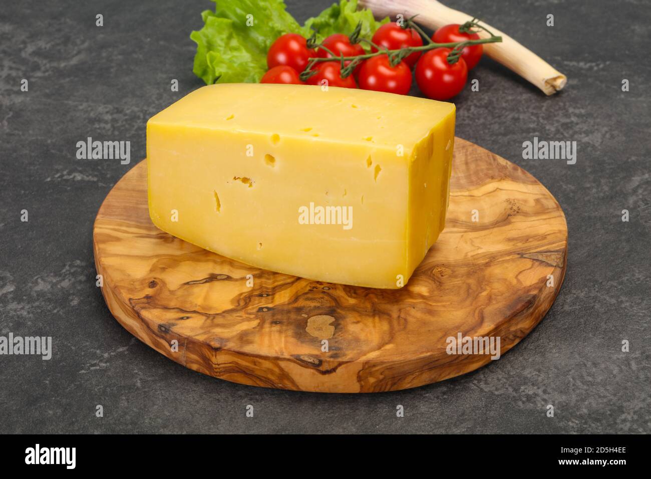 Swiss Hard yellow tasty cheese brick Stock Photo - Alamy