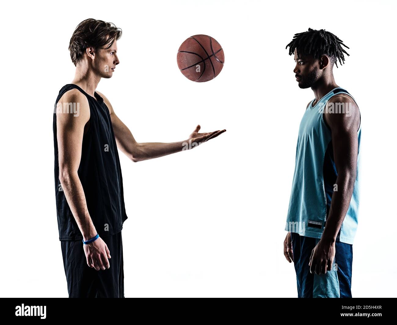 two basketball players men isolated in silhouette shadow on white ...