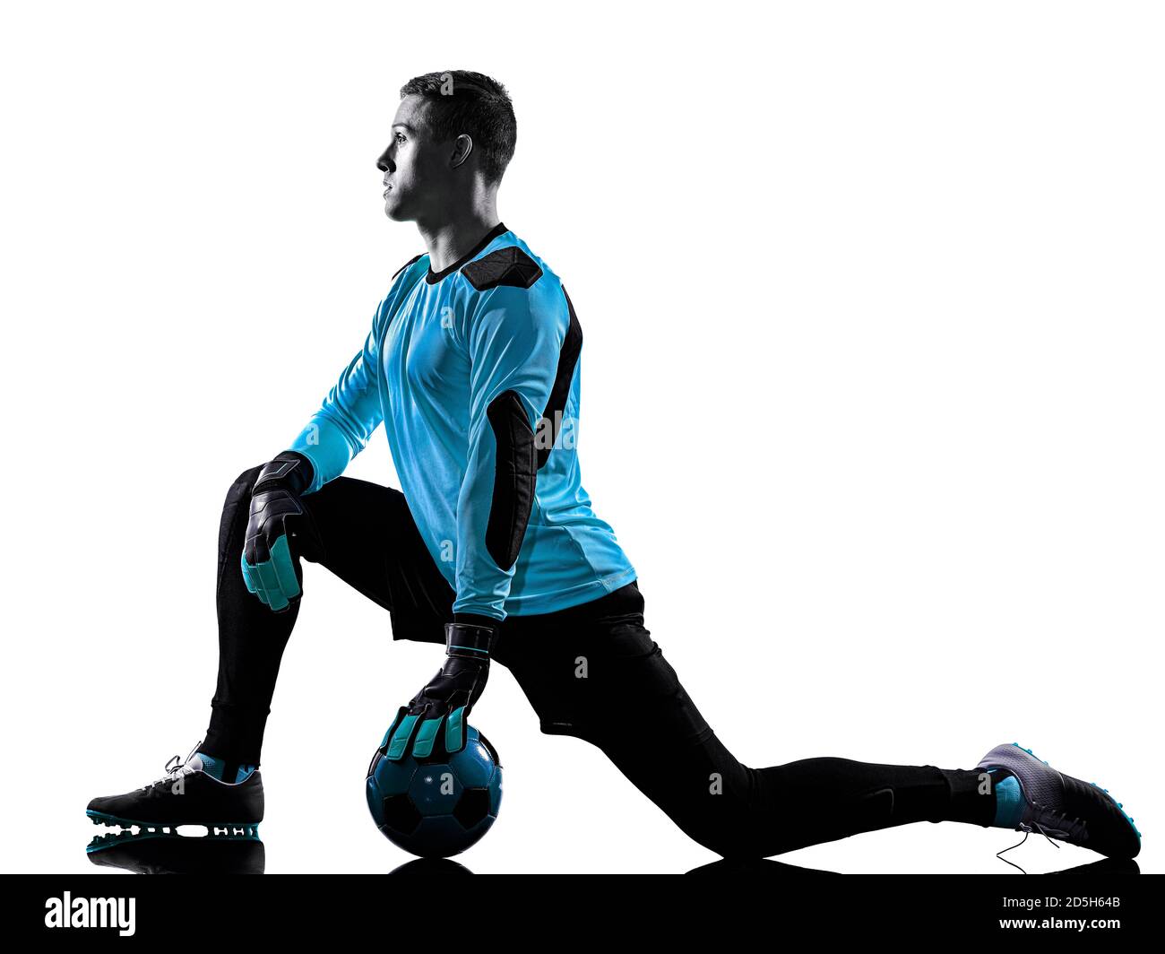 one caucasian soccer player goalkeeper man in studio silhouette shadow ...