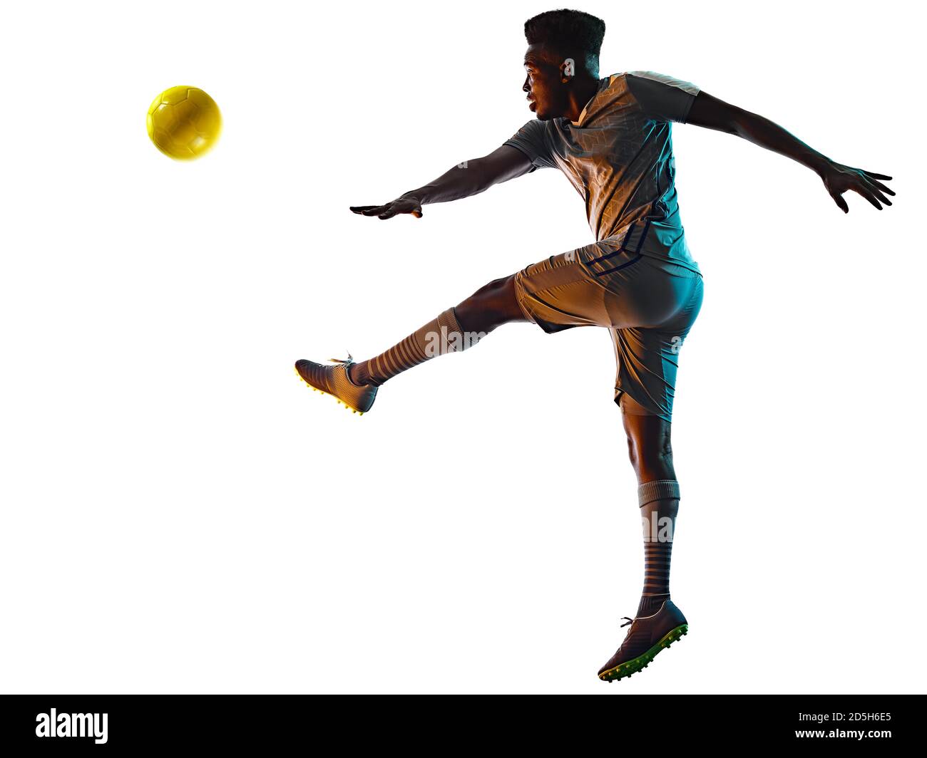 young african soccer player man in studio isolated on white background ...