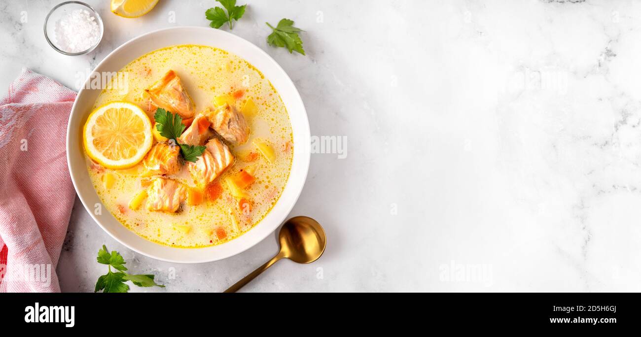 Top view of salmon fish soup on white background Stock Photo - Alamy