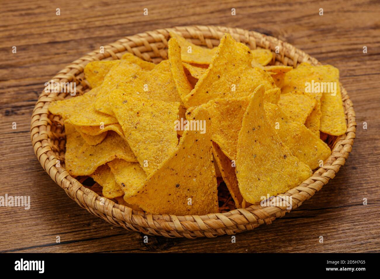 Mexican crunchy corn nachos triangle heap Stock Photo - Alamy