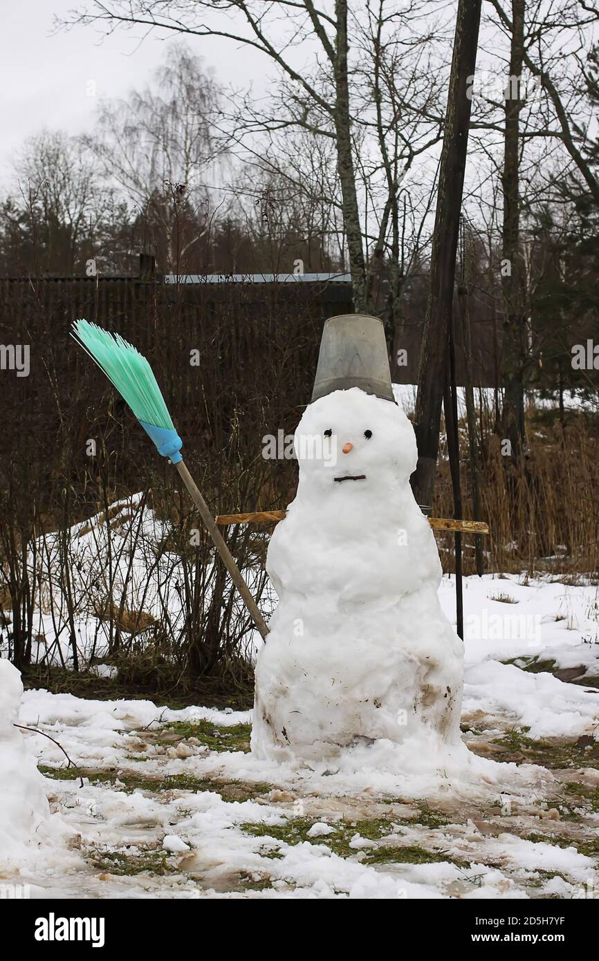 Cute snowman on rural yard Stock Photo - Alamy